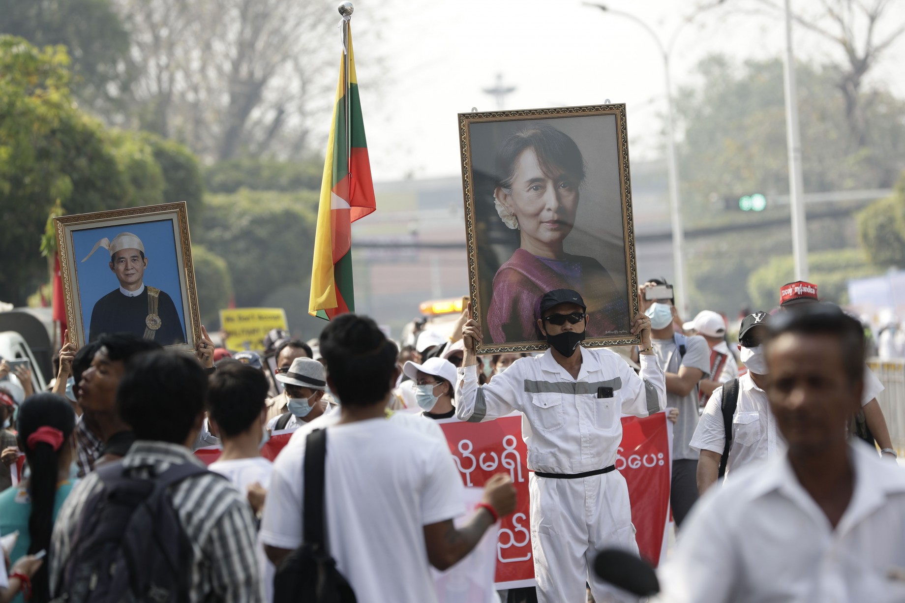 Myanmar junta cuts Suu Kyi, Win Myint sentences in half